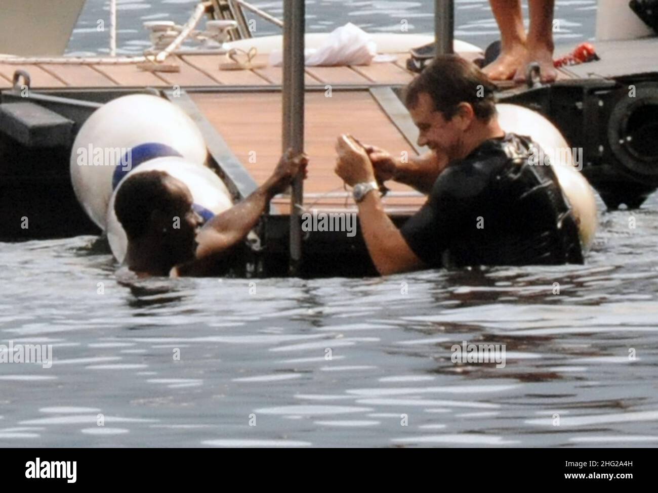 Matt Damon and Don Cheadle with his family are seen on holiday at Lake ...