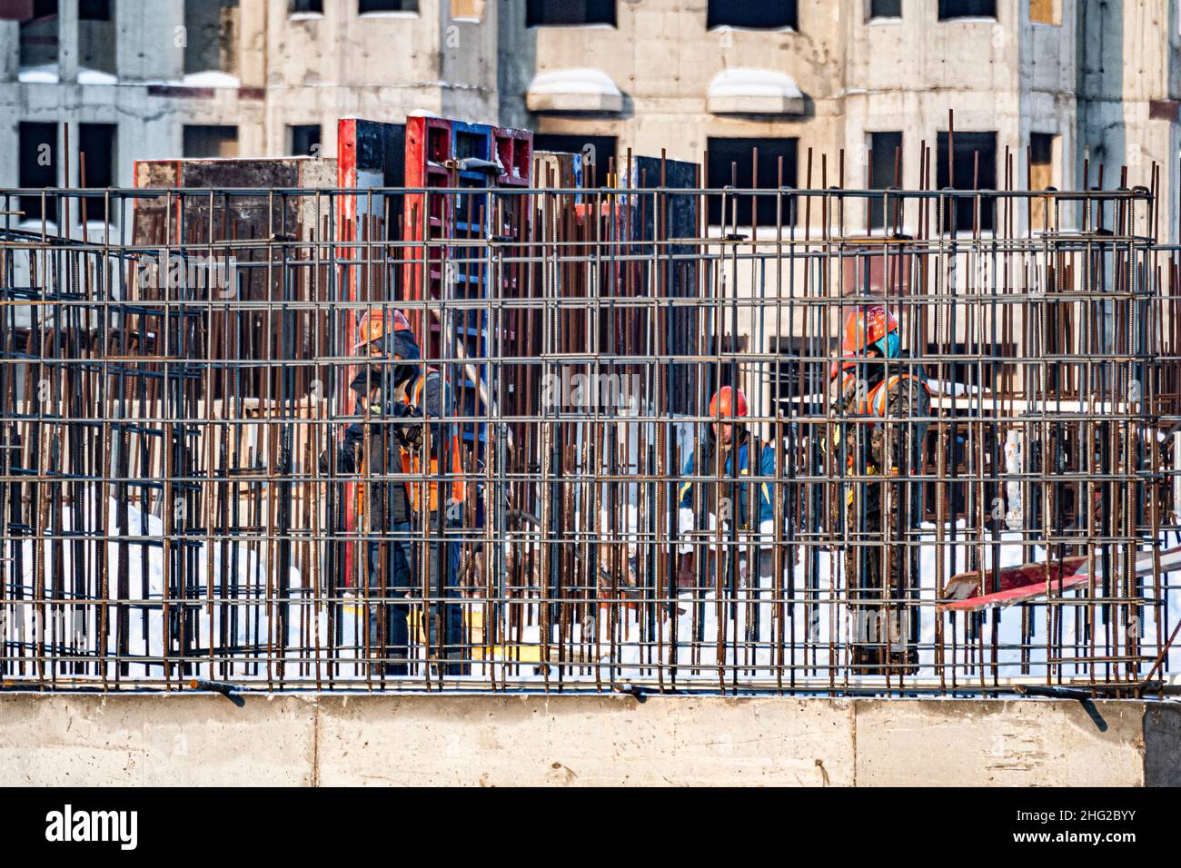 Russia, Moscow. Workers at the construction site of residential complex ...