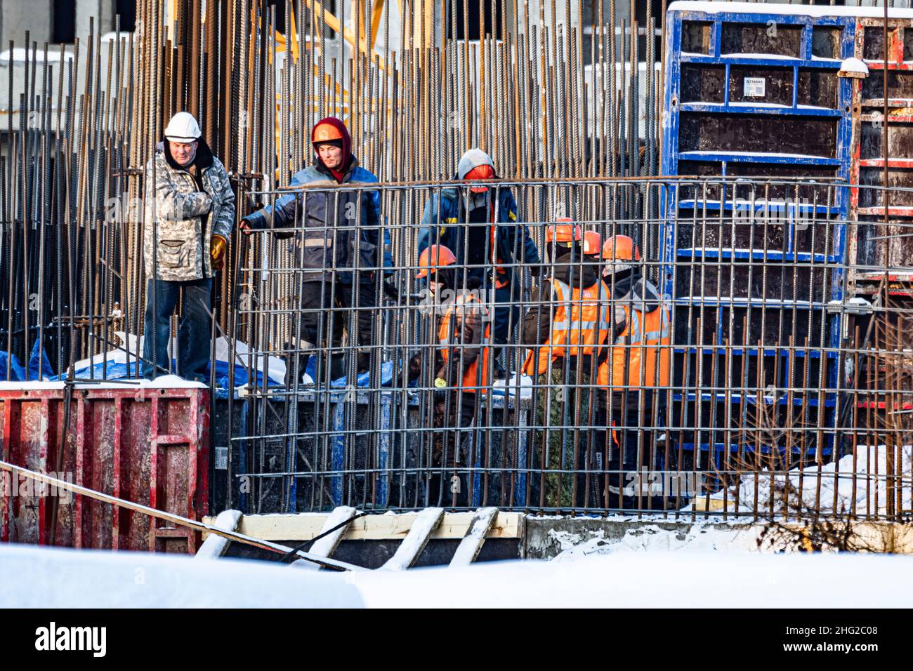 Russia, Moscow. Workers at the construction site of residential complex ...
