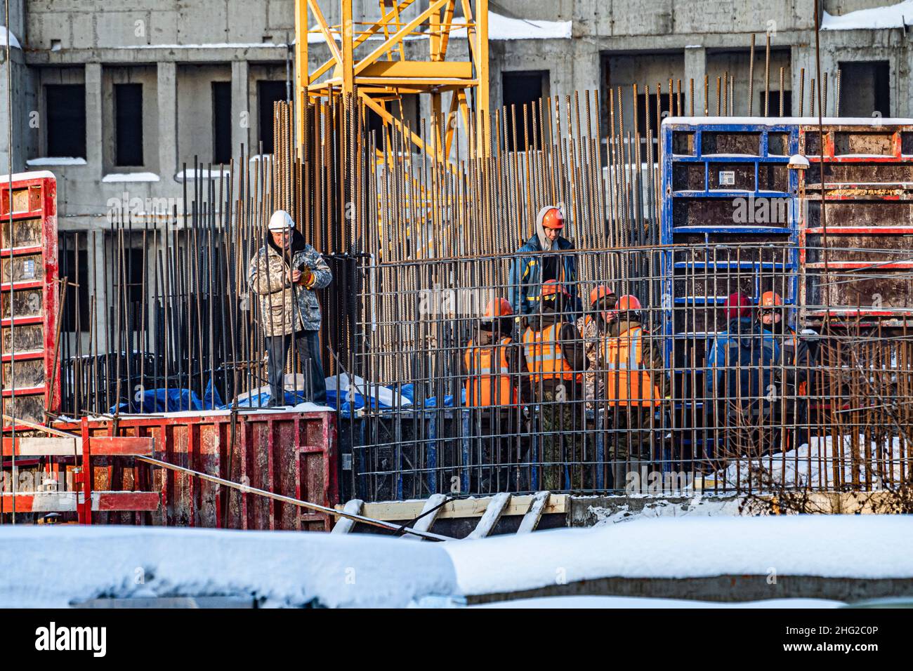 Russia, Moscow. Workers at the construction site of residential complex ...
