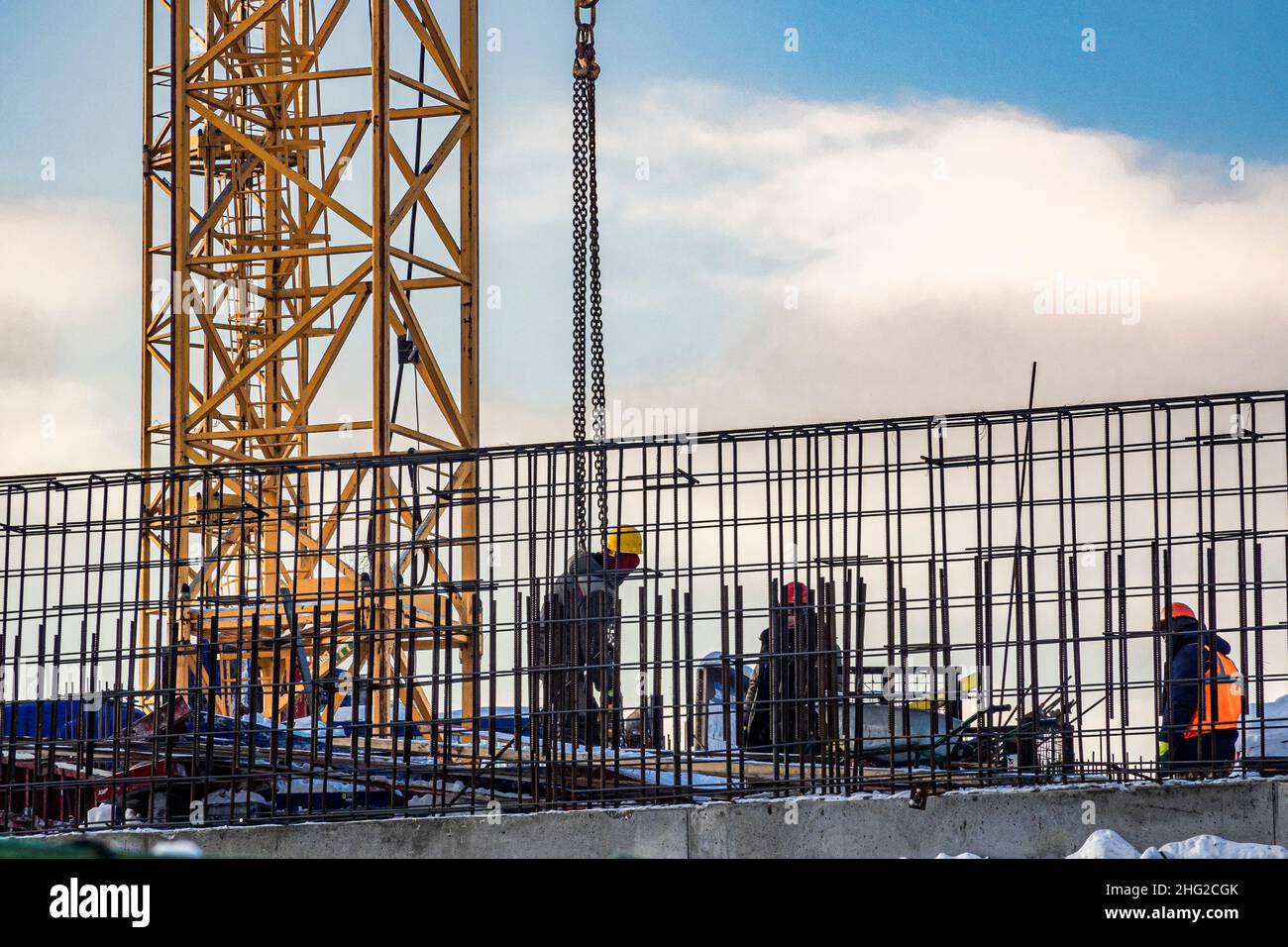 Russia, Moscow. Workers at the construction site of residential complex ...