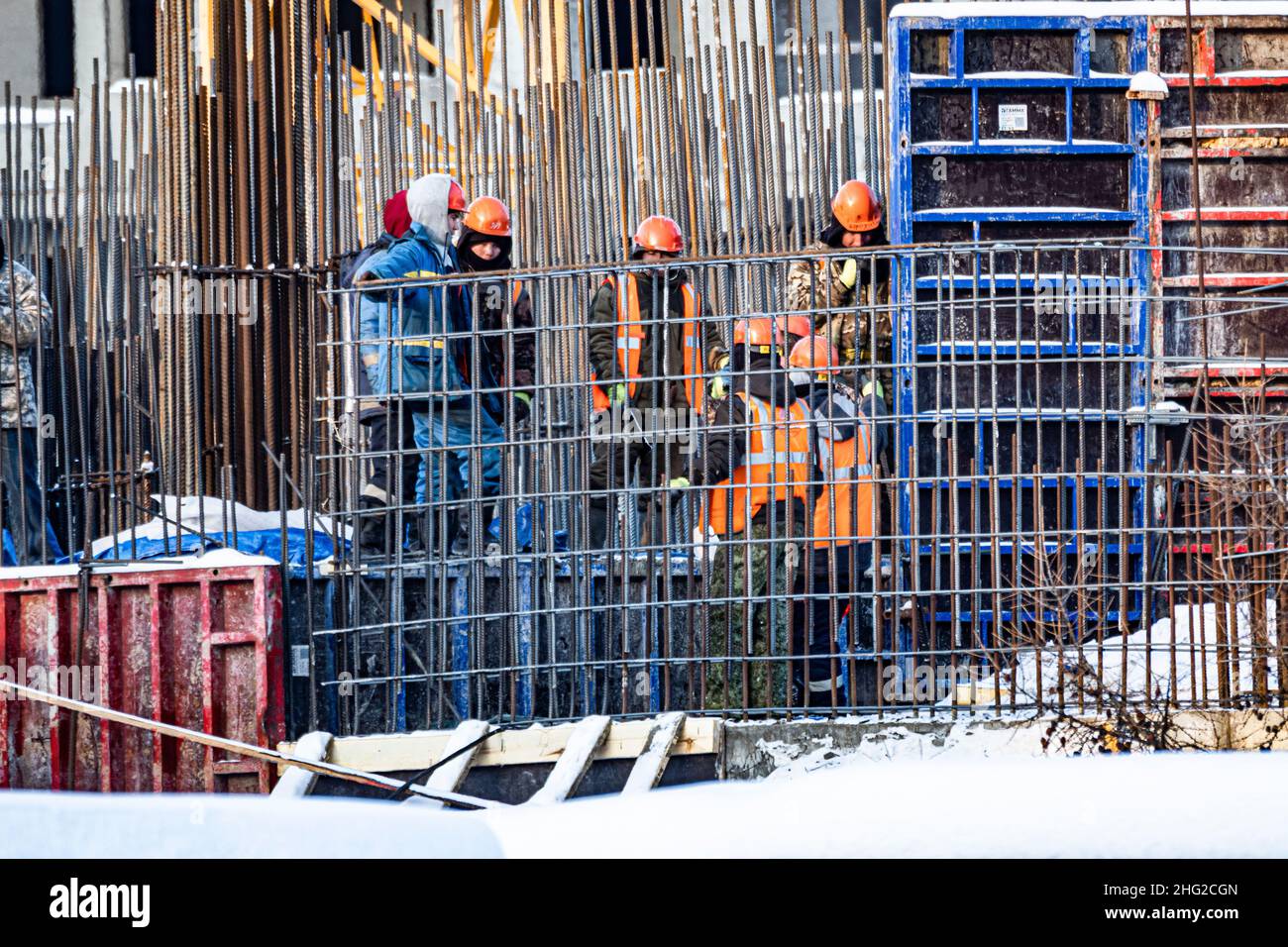 Russia, Moscow. Workers at the construction site of residential complex ...