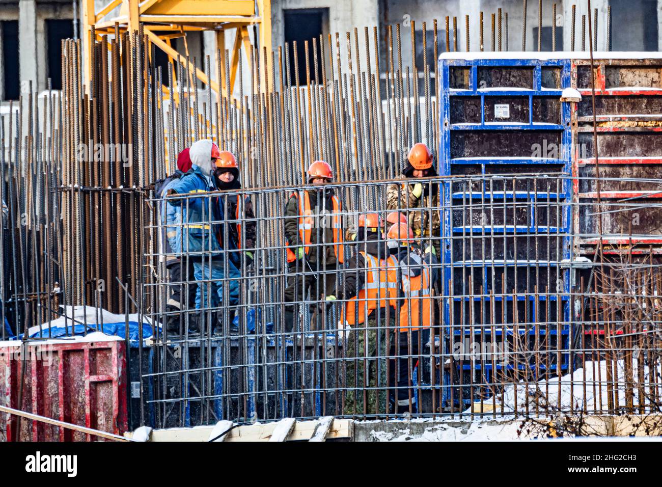 Russia, Moscow. Workers at the construction site of residential complex ...