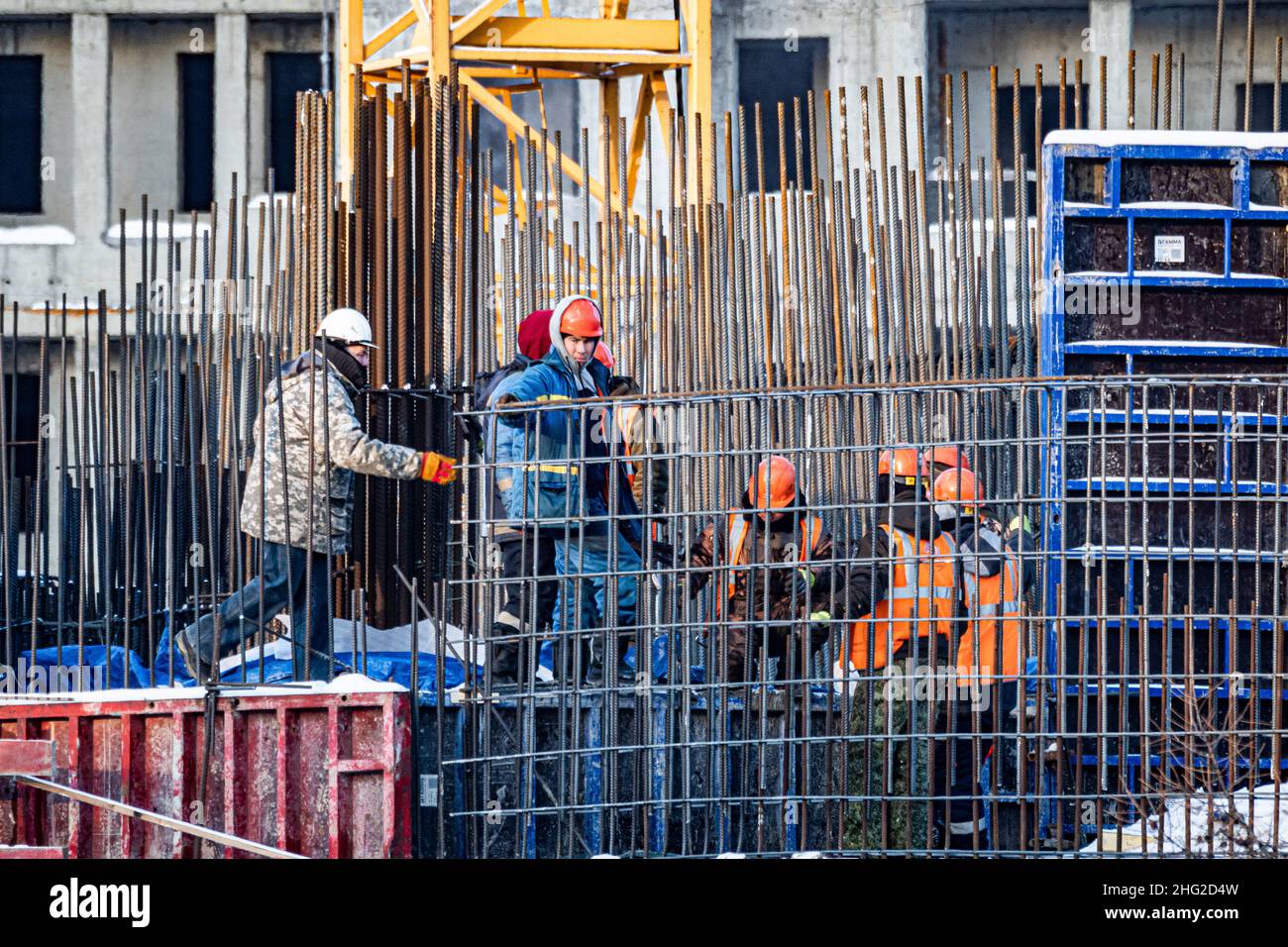 Russia, Moscow. Workers at the construction site of residential complex ...