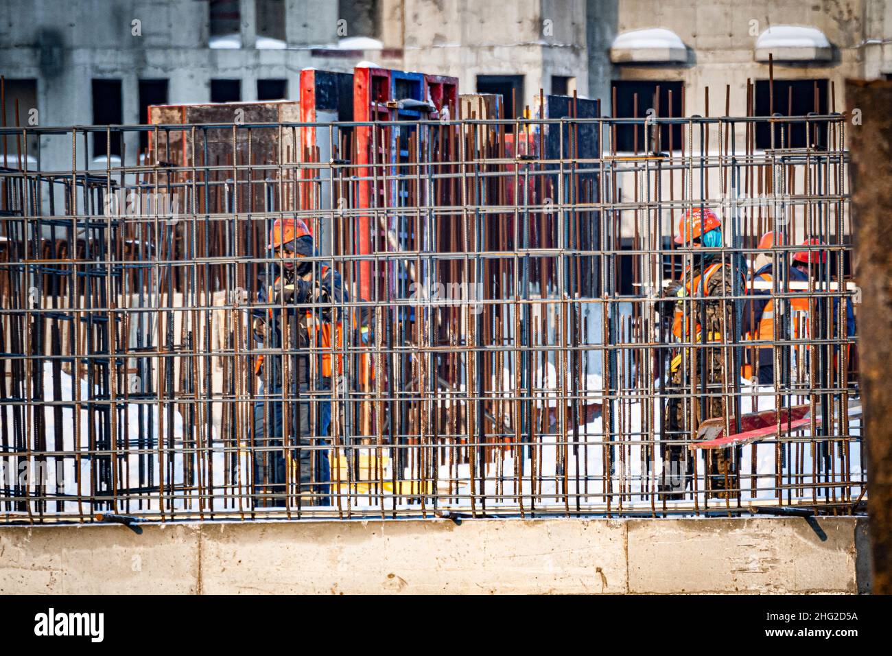 Russia, Moscow. Workers at the construction site of residential complex ...