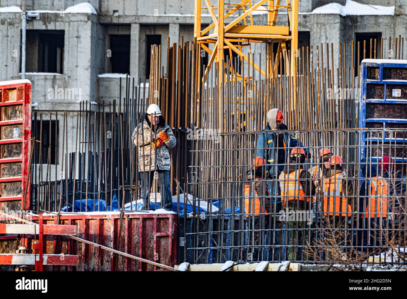 Russia, Moscow. Workers at the construction site of residential complex ...