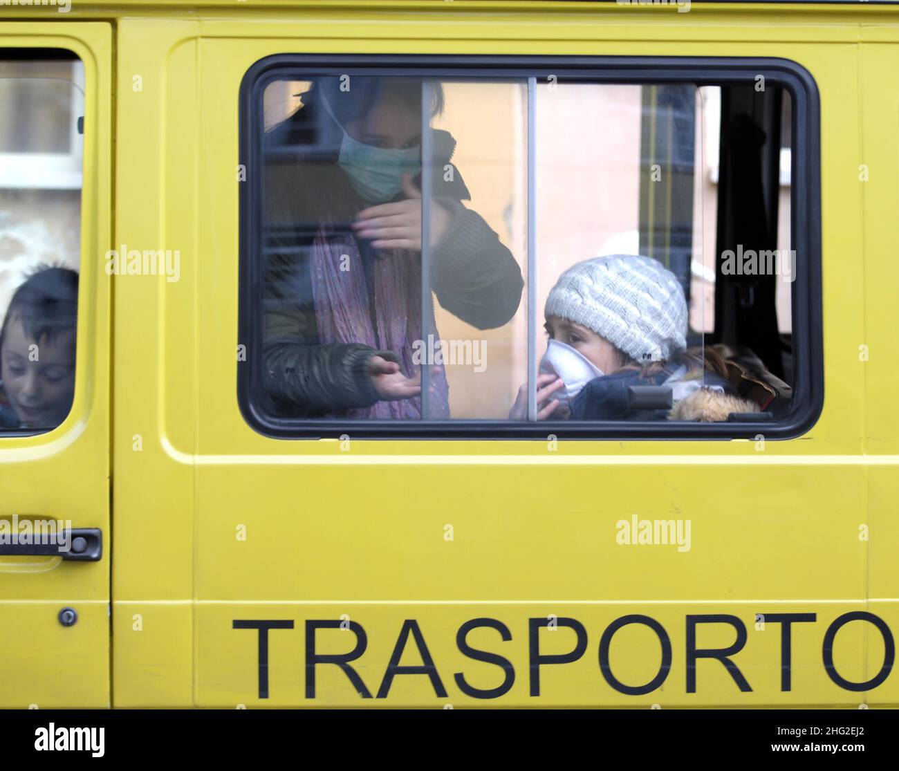 Children on a school bus in Napoli, Italy, with masks on to prevent ...