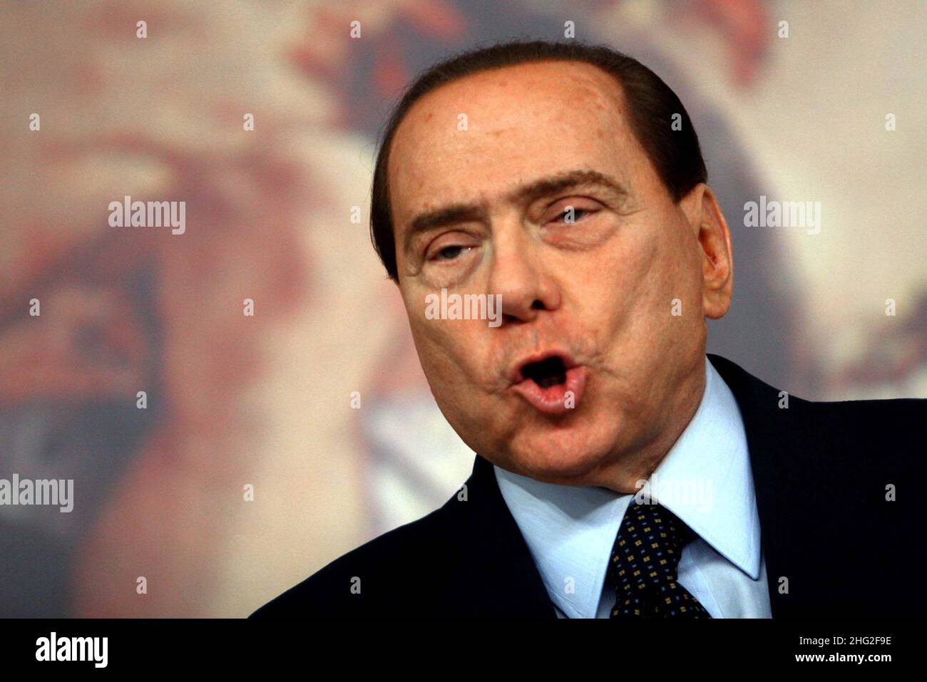 Italian Premier Silvio Berlusconi speaks during a press conference ...