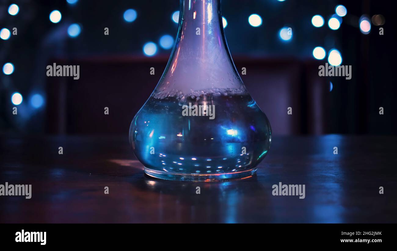 Camera moving towards the glass flask vase for a hookah. Transparent ...