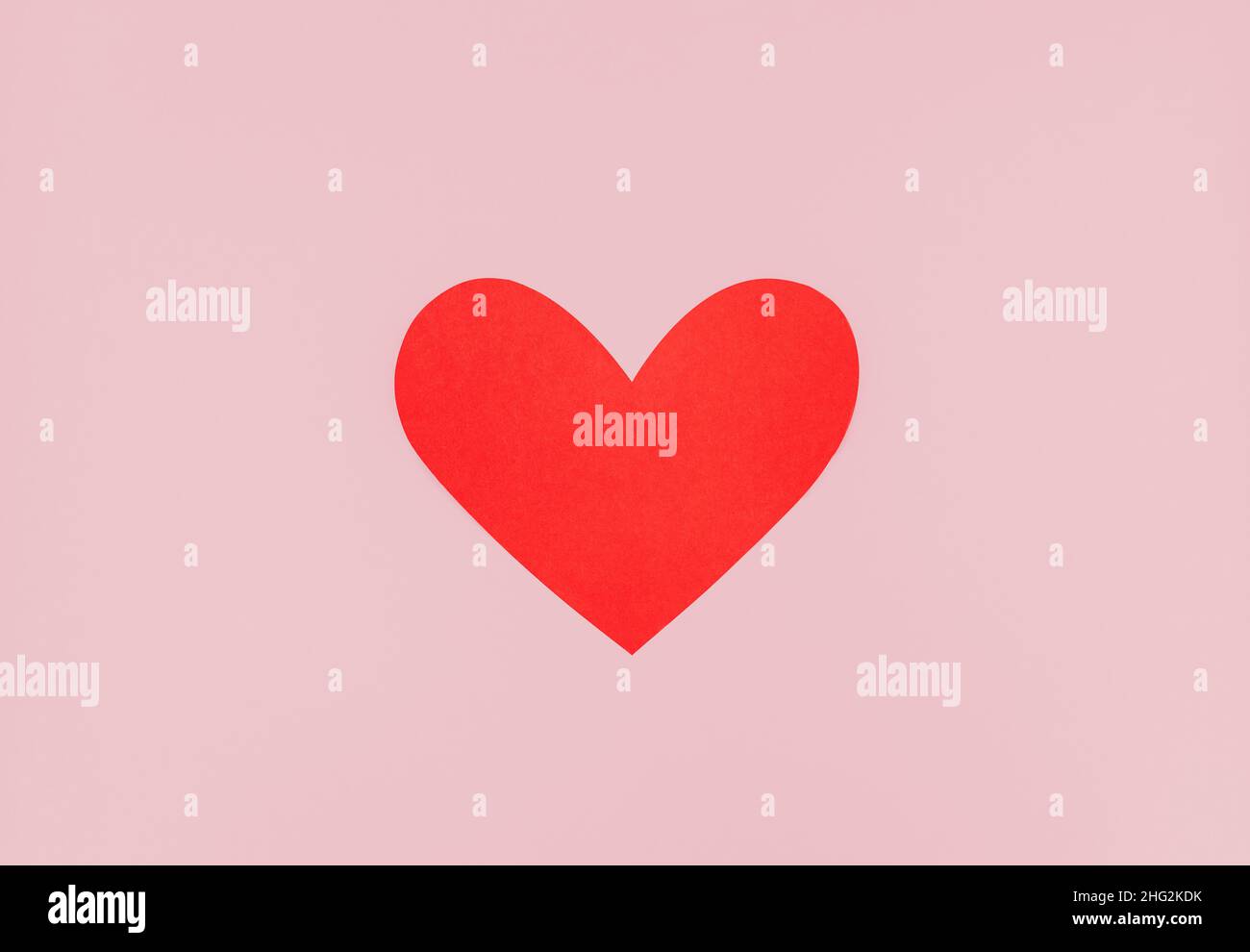Big red paper heart on pastel pink background Stock Photo - Alamy