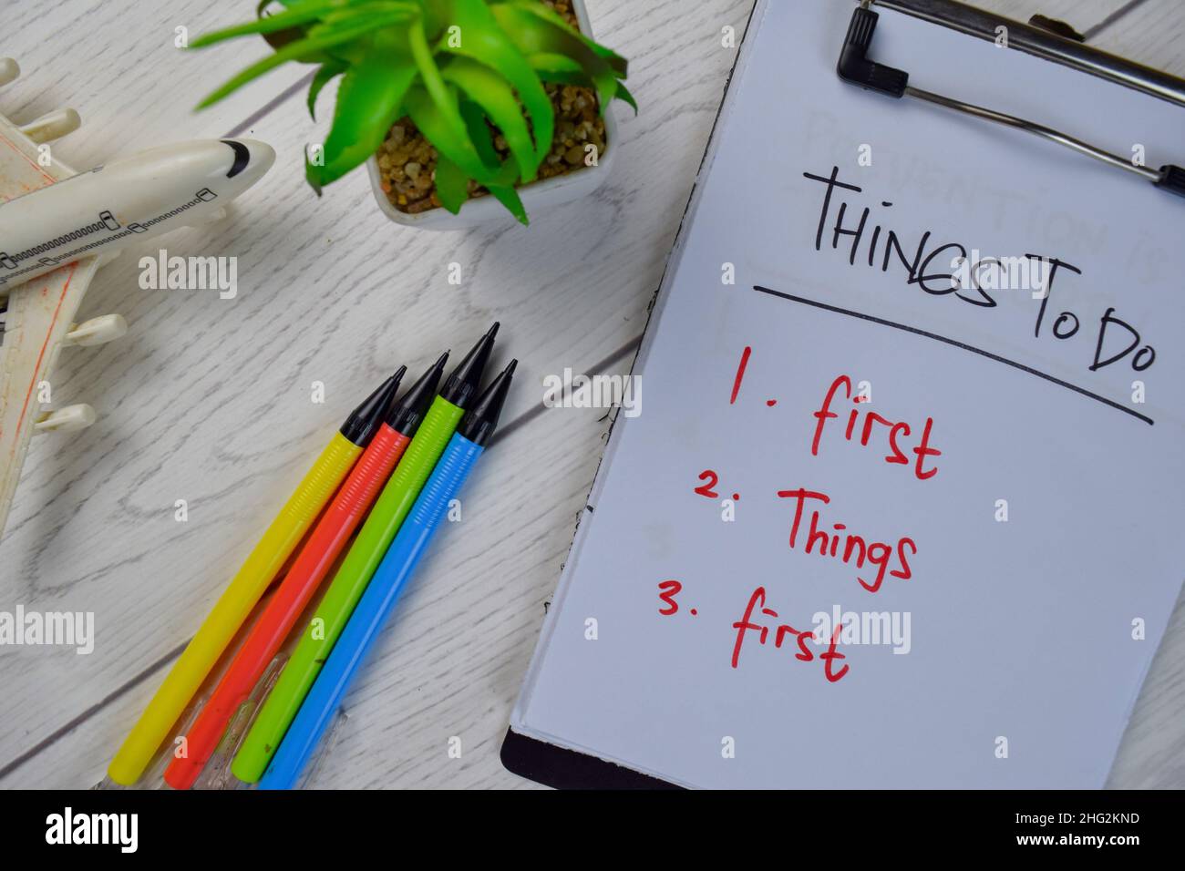 Things To Do - First Things First write on a paperwork and supported by ...