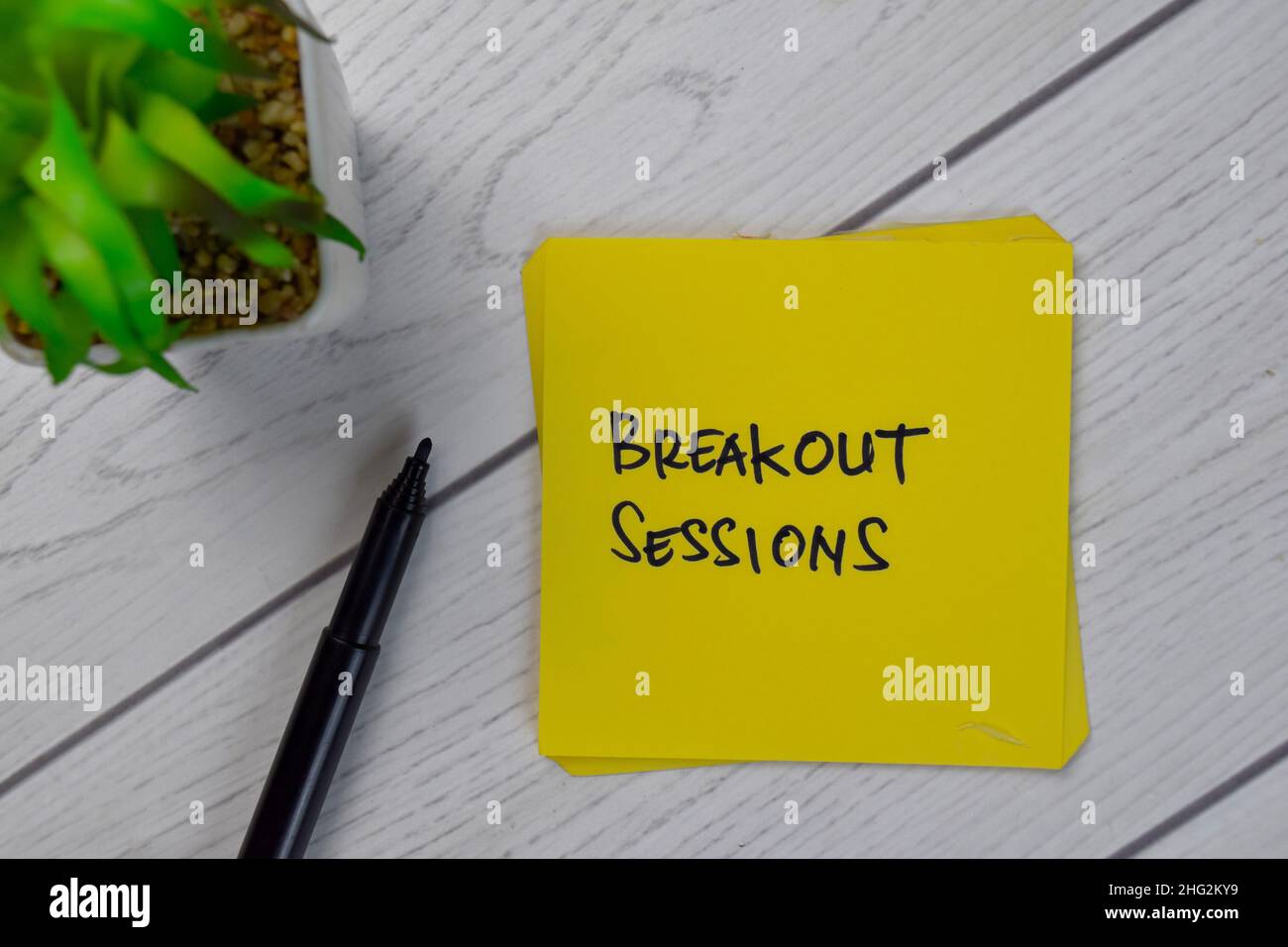 Breakout Sessions write on sticky notes isolated on Wooden Table Stock ...