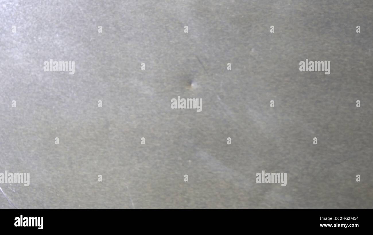 Top view of liquid oil flowing on metal sheet. Movement of liquid oily ...