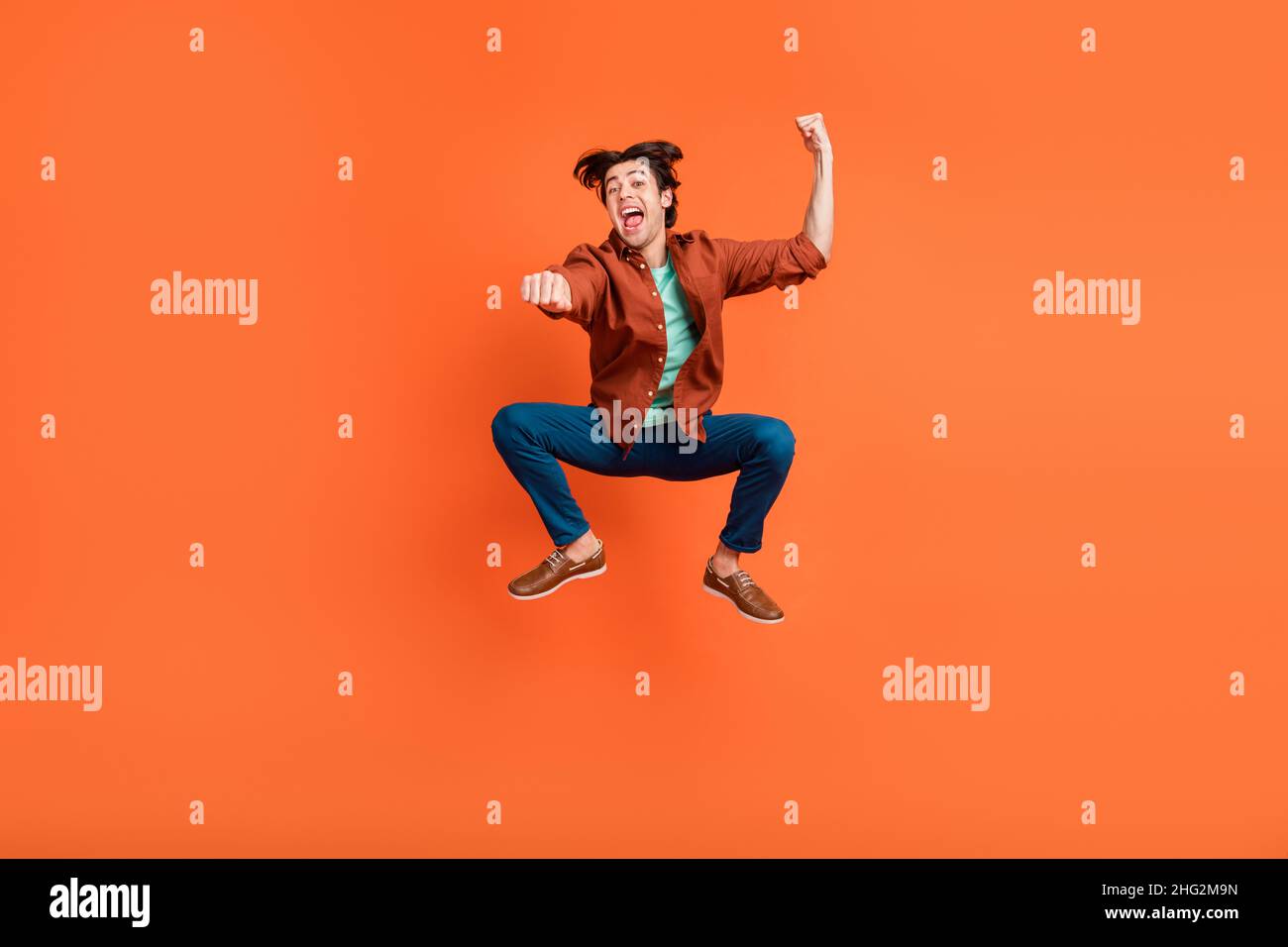 Full size photo of cheerful funky carefree male jumping rodeo cowboy ...