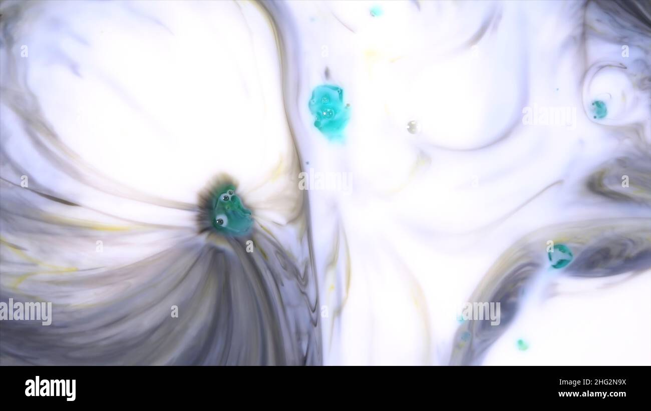 Colorful background of ink reaction to soap drops. Colored inks react ...