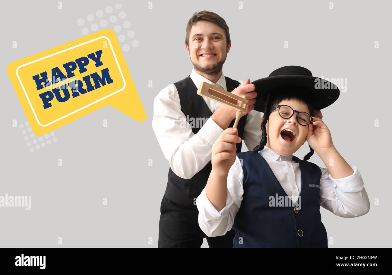 Happy Jewish man and boy in traditional costumes and with gragger for ...