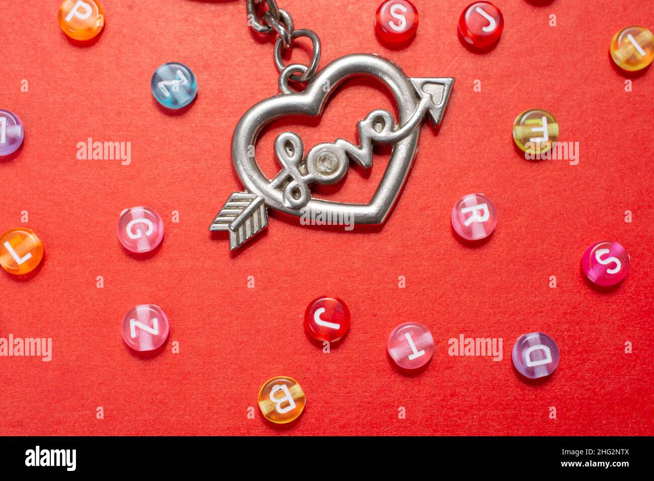 Heart shape and love wording amid colorful alphabet letters Stock Photo ...