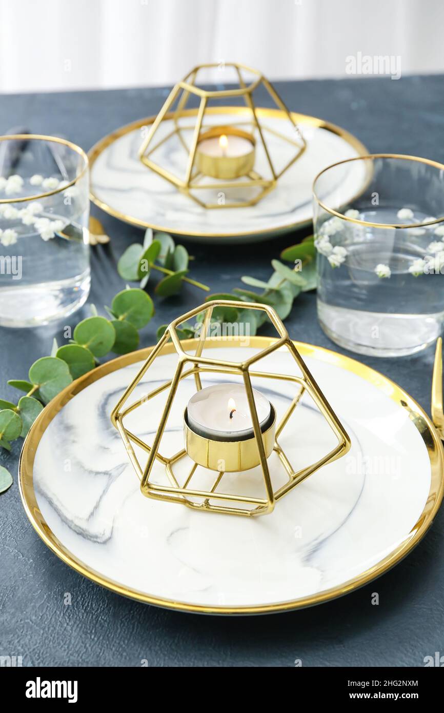 Beautiful table setting with candle holders Stock Photo - Alamy