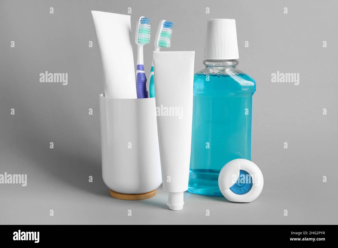 Dental care set on grey background Stock Photo - Alamy