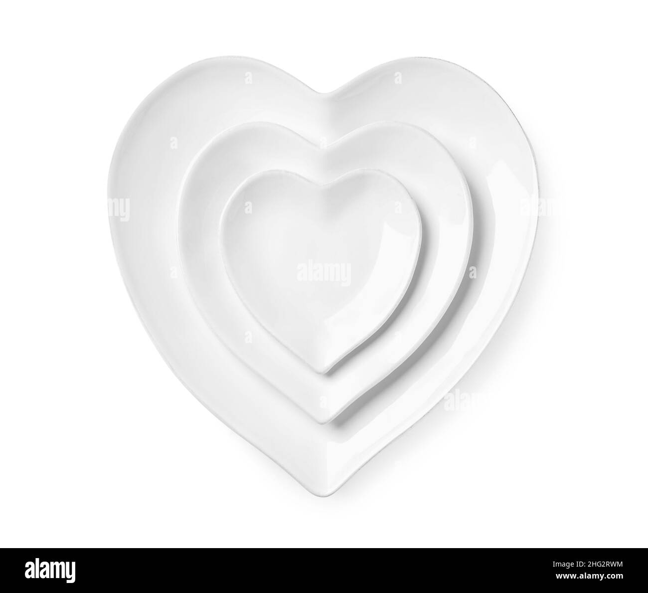 Beautiful heart-shaped plates on white background Stock Photo - Alamy