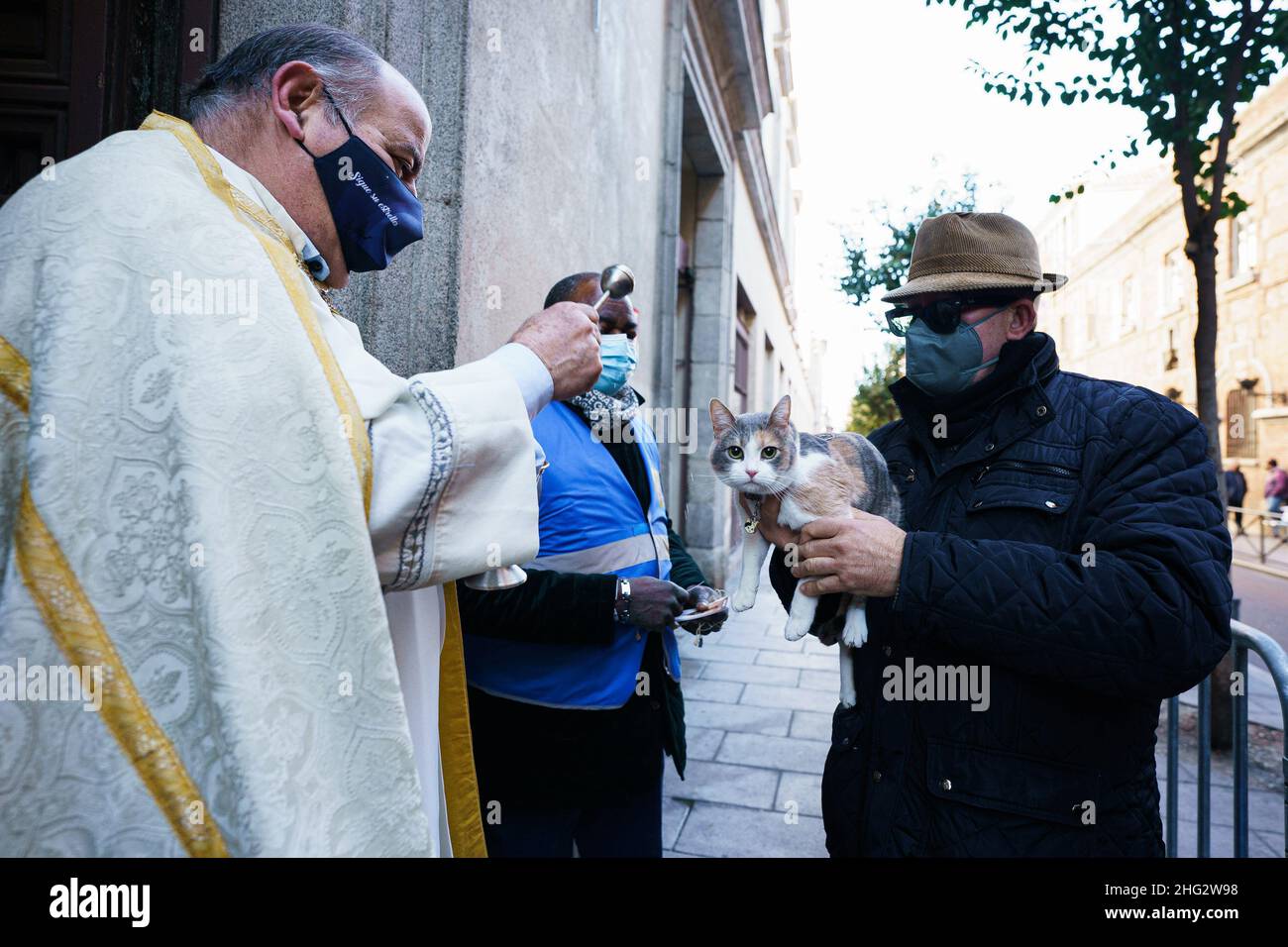 A priest is seen blessing a cat at the tradition of San Antonio ...