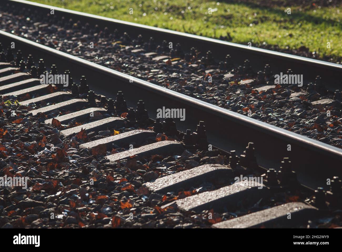Railway track closeup, rails, fasteners, railroad ties of train tracks ...