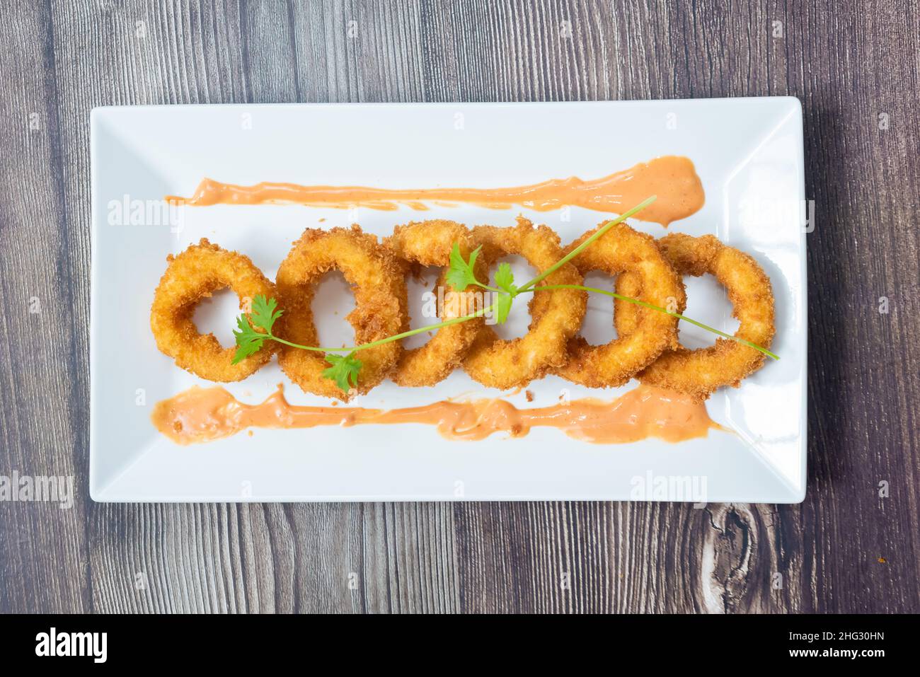 Crispy fried squid rolls. Ingredients include fresh squid and ruffles ...