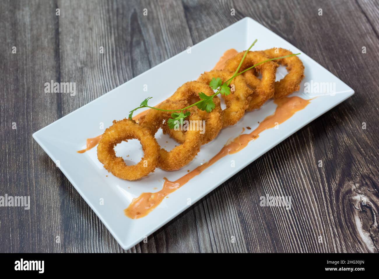 Crispy fried squid rolls. Ingredients include fresh squid and ruffles ...