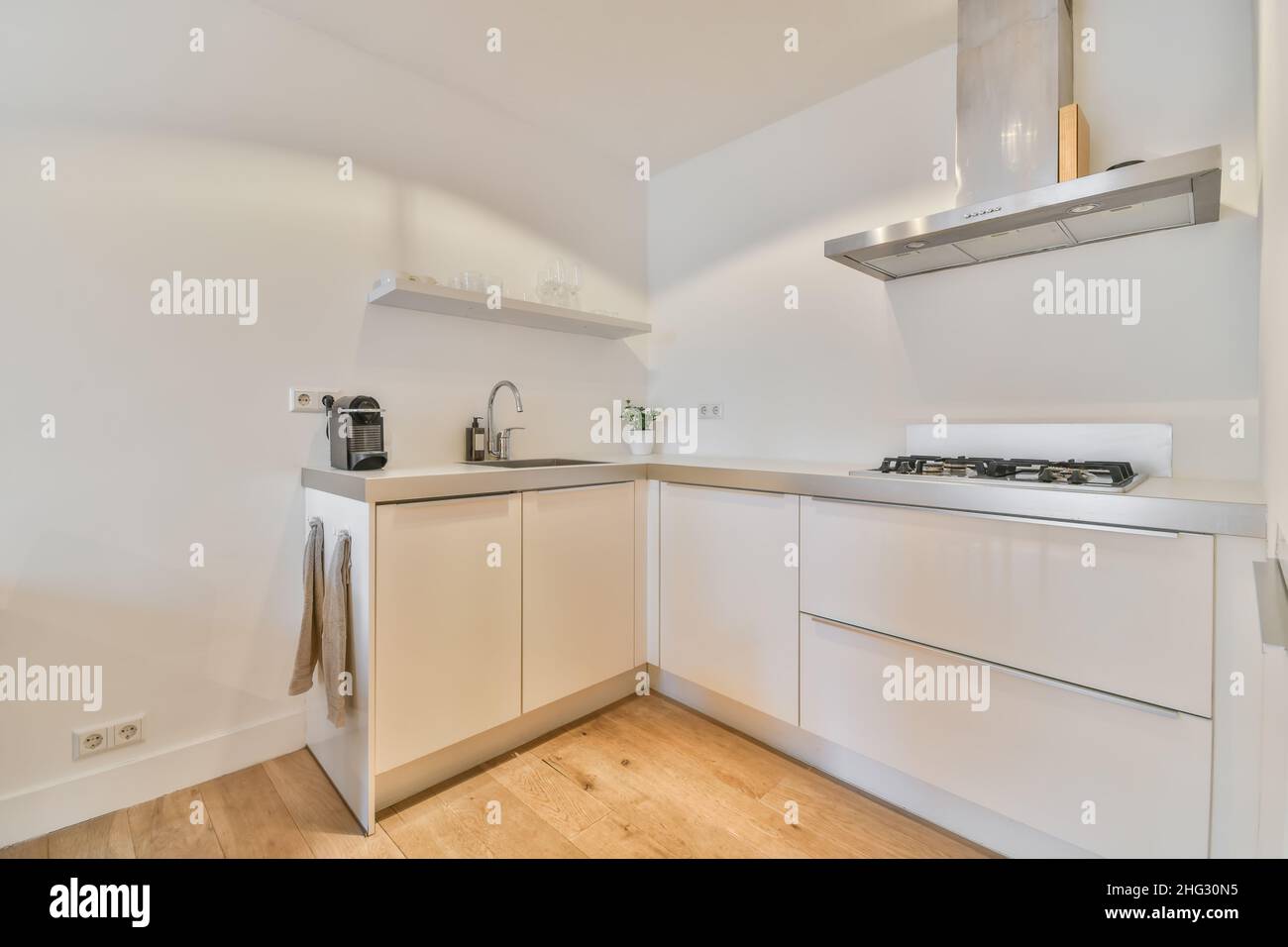 Cozy and strong kitchen area in daylight with flowers Stock Photo - Alamy