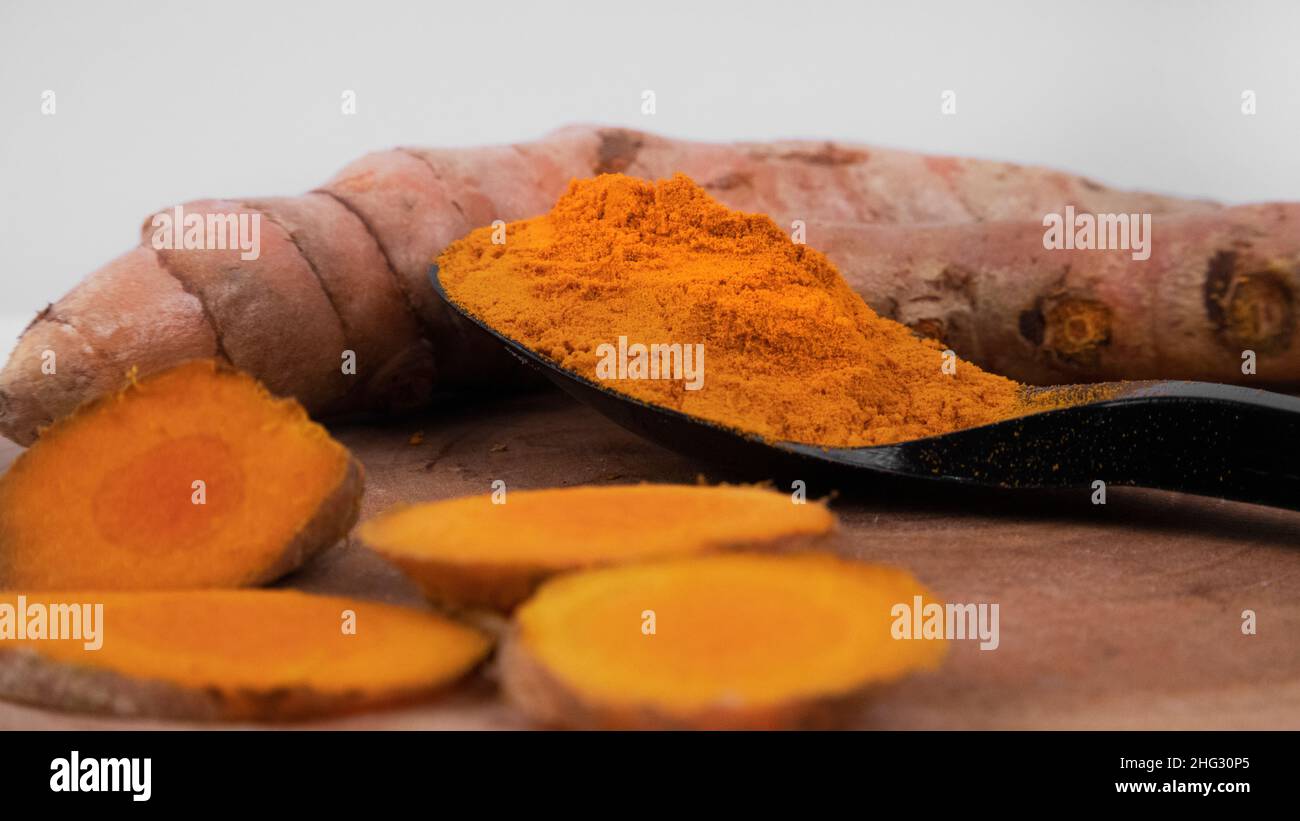 Close Up A Spoonful of Turmeric Powder Stock Photo - Alamy