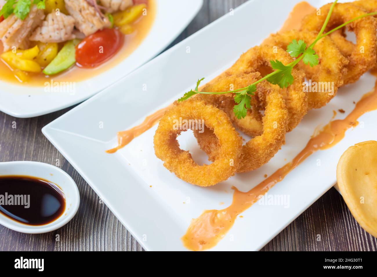 Crispy fried squid rolls. Ingredients include fresh squid and ruffles ...