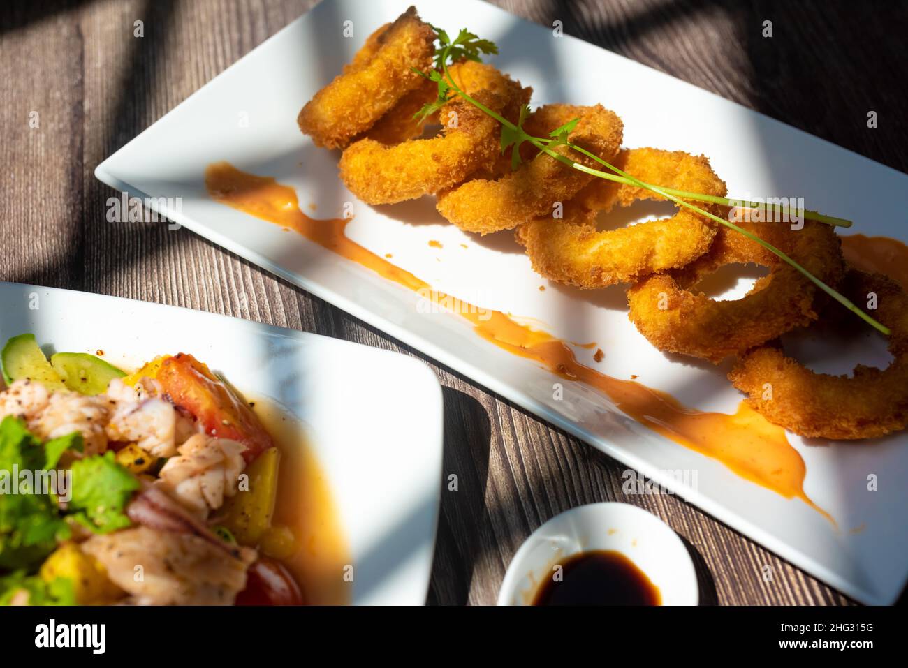 Crispy fried squid rolls. Ingredients include fresh squid and ruffles ...