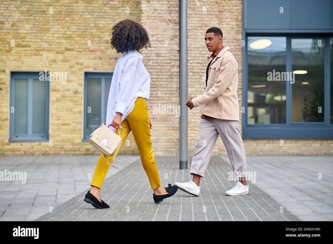 Two people walking towards each other hi-res stock photography and ...