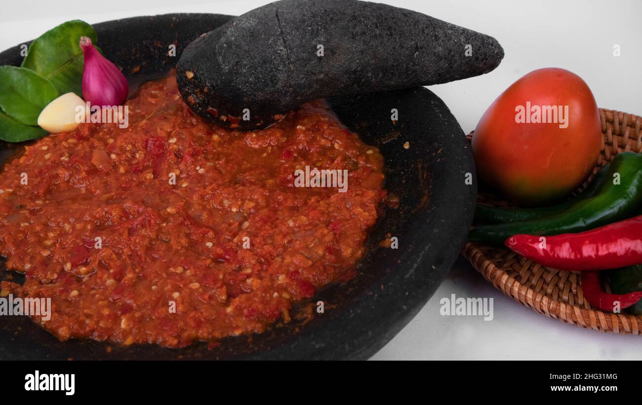 Grinded Red Chili Pepper on a Mortar and Pestle Stock Photo - Alamy