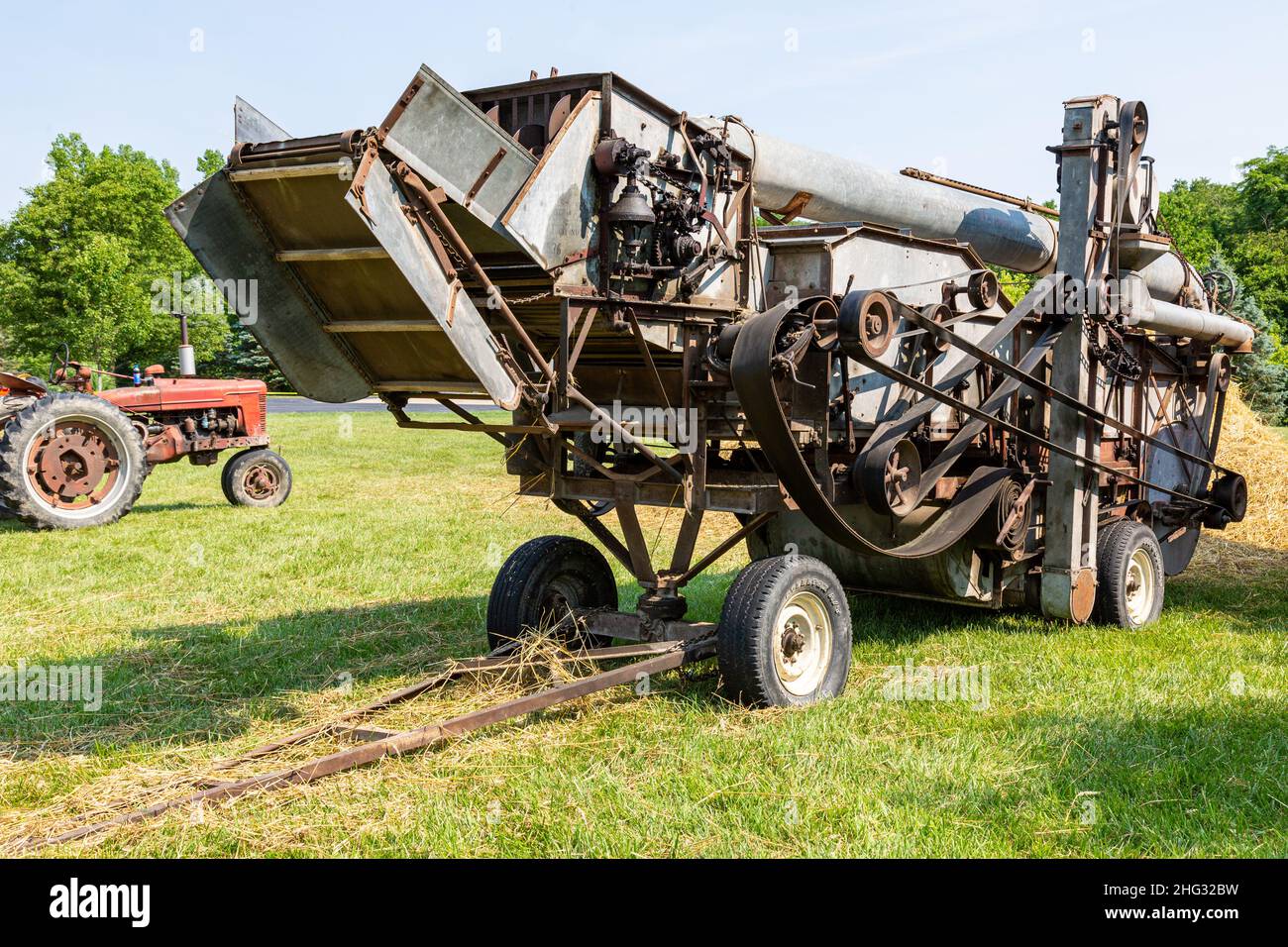 An antique hay baler Stock Photo - Alamy