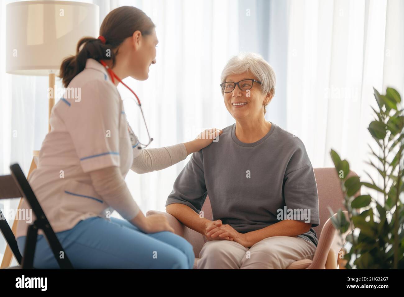 Female patient listening to a doctor in hospital Stock Photo - Alamy