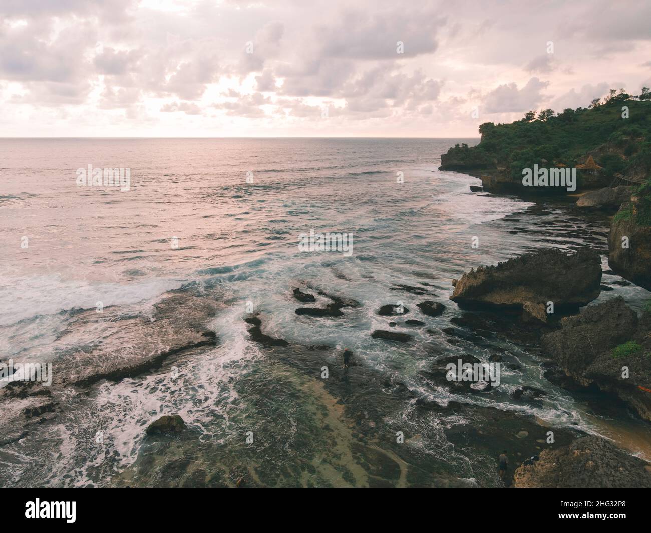 Aerial view of Baron beach in Yogyakarta, Indonesia with lighthouse and ...