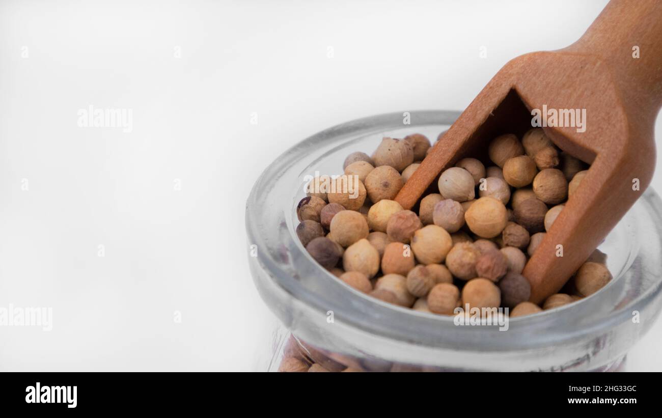 Scooping White Pepper with Wooden Spoon Stock Photo - Alamy