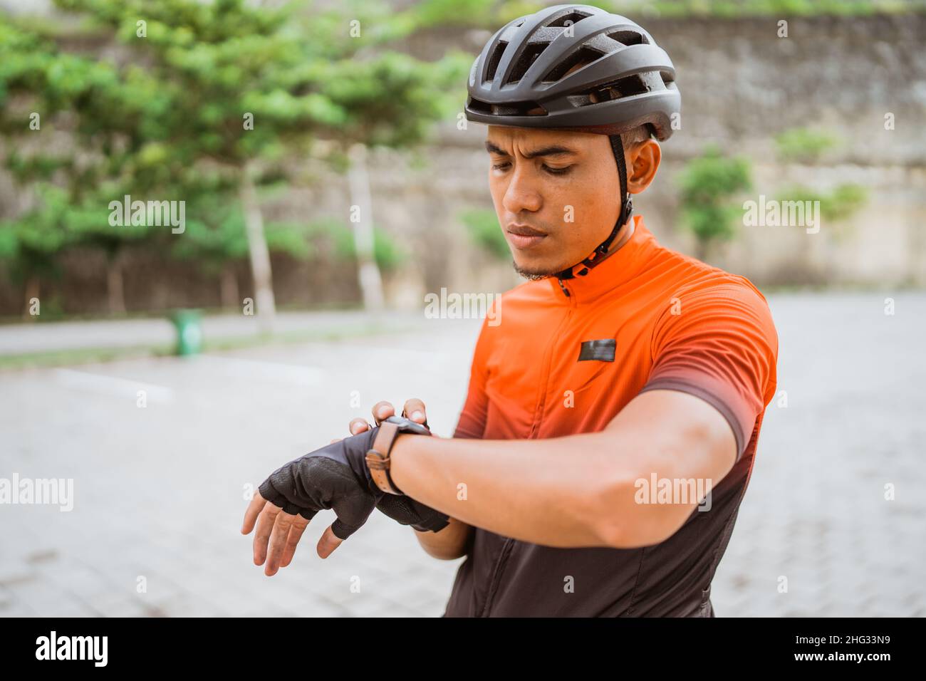 cyclist check his workout progress on a smart watch Stock Photo - Alamy