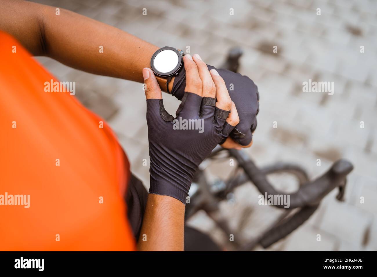 cyclist check his workout progress on a smart watch Stock Photo - Alamy