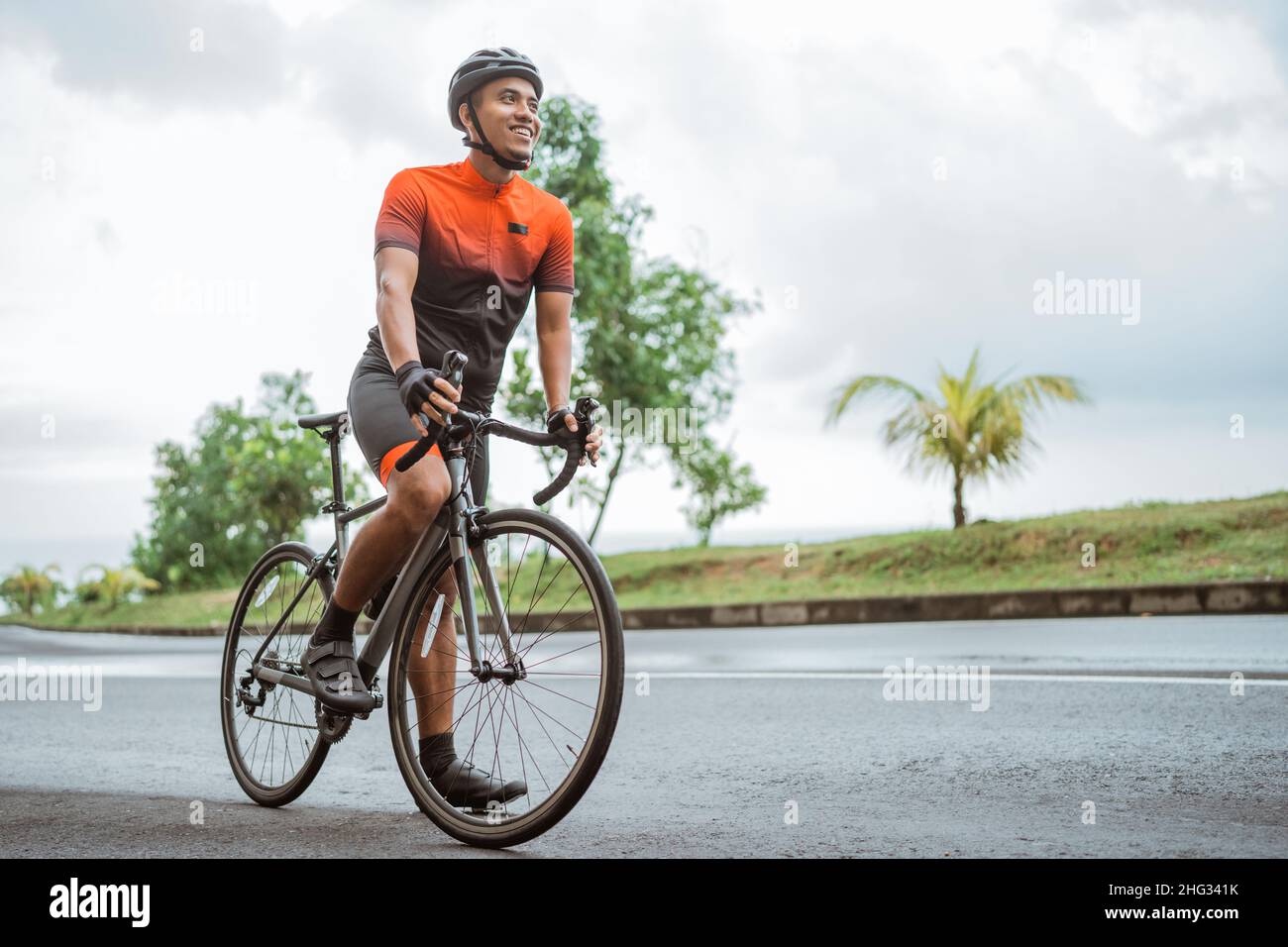 happy smiling road bike cyclist while riding his bike outdoor Stock ...
