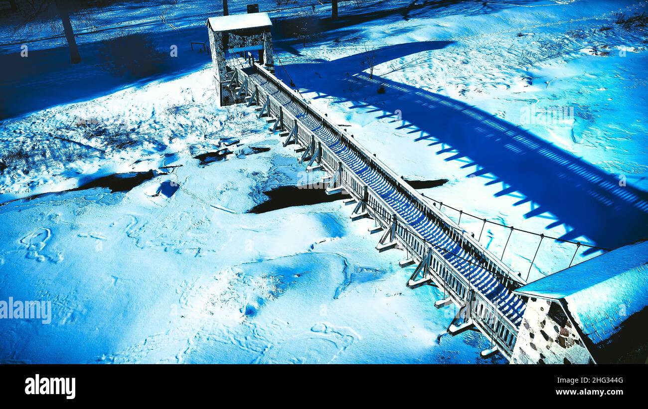 Footbridge over frozen river hi-res stock photography and images - Alamy