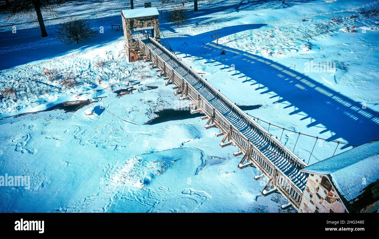 Aerial of frozen park walking bridge Stock Photo - Alamy