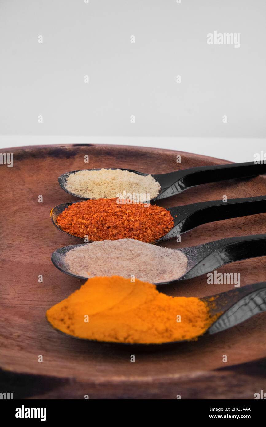 Spoonful of Grounded Spices Portrait Stock Photo - Alamy