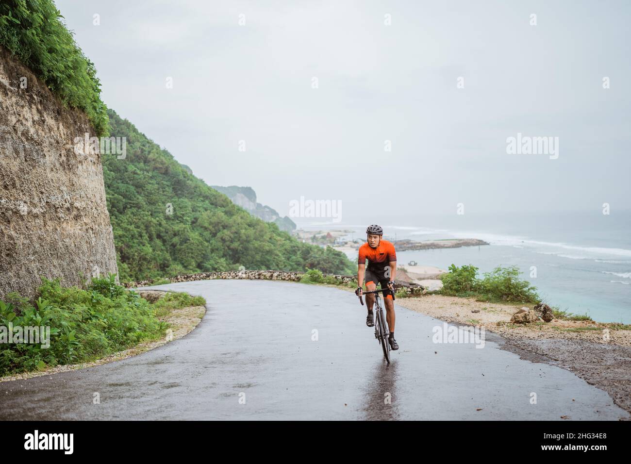 road bike cyclist riding his bike on a cliff Stock Photo - Alamy