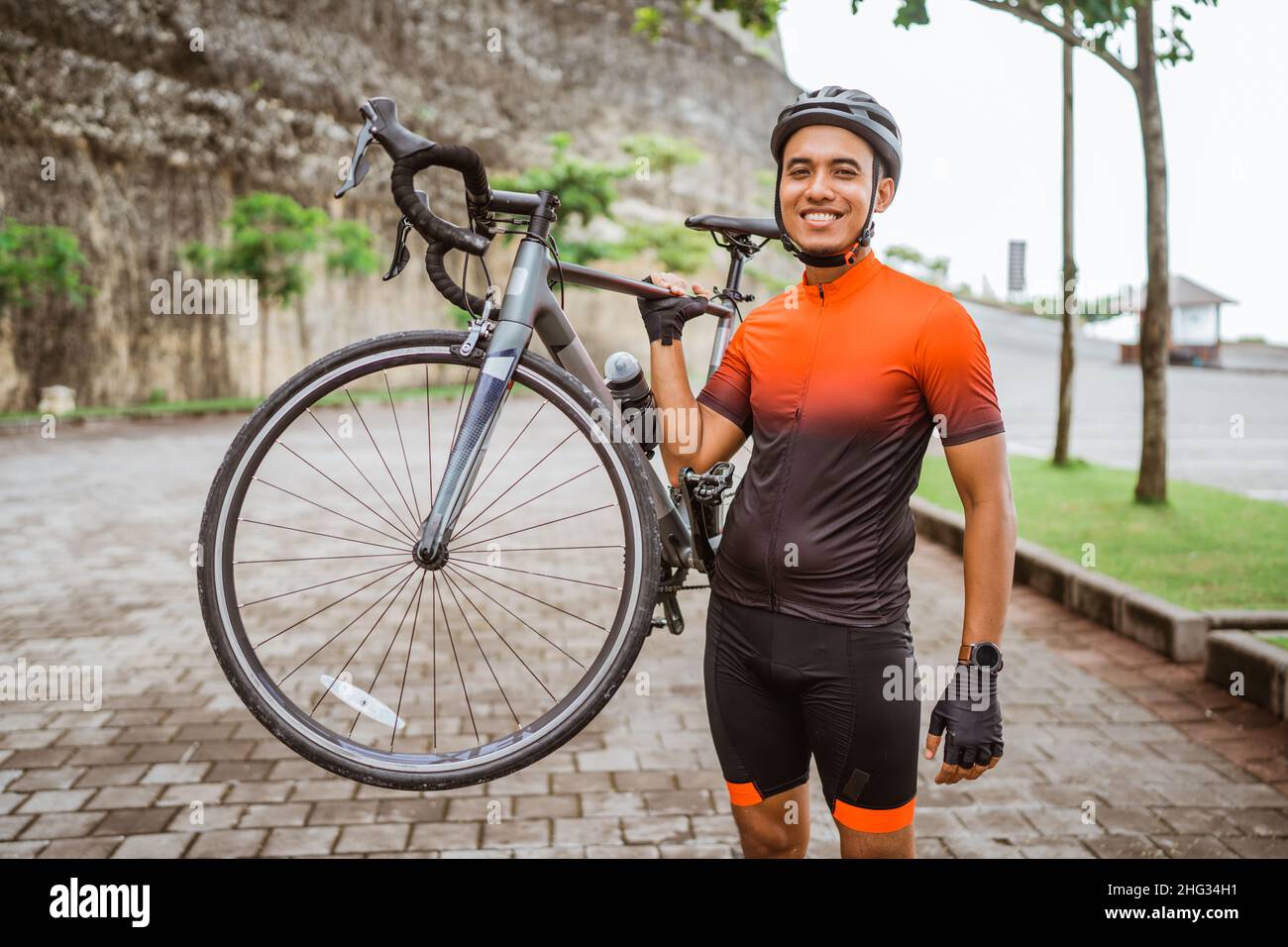 happy smiling road bike cyclist while riding his bike outdoor Stock ...
