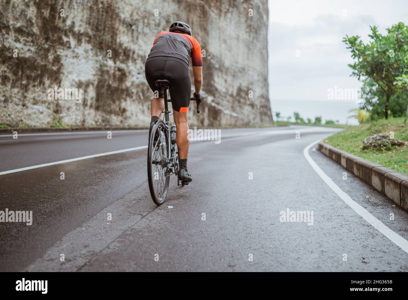 male cyclist riding his bike in country side shoot from the back Stock ...
