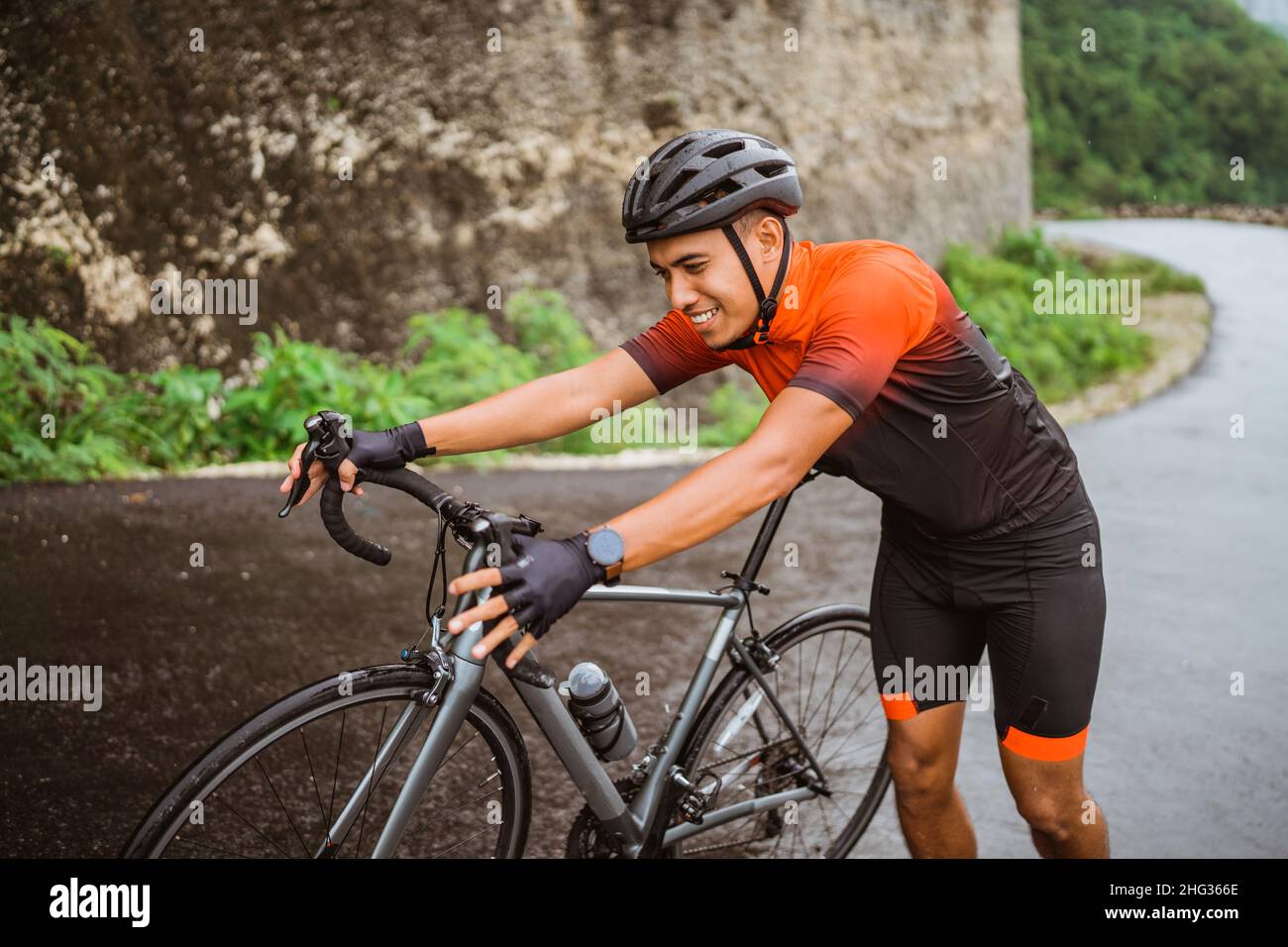 Pushing bike tired hi-res stock photography and images - Alamy