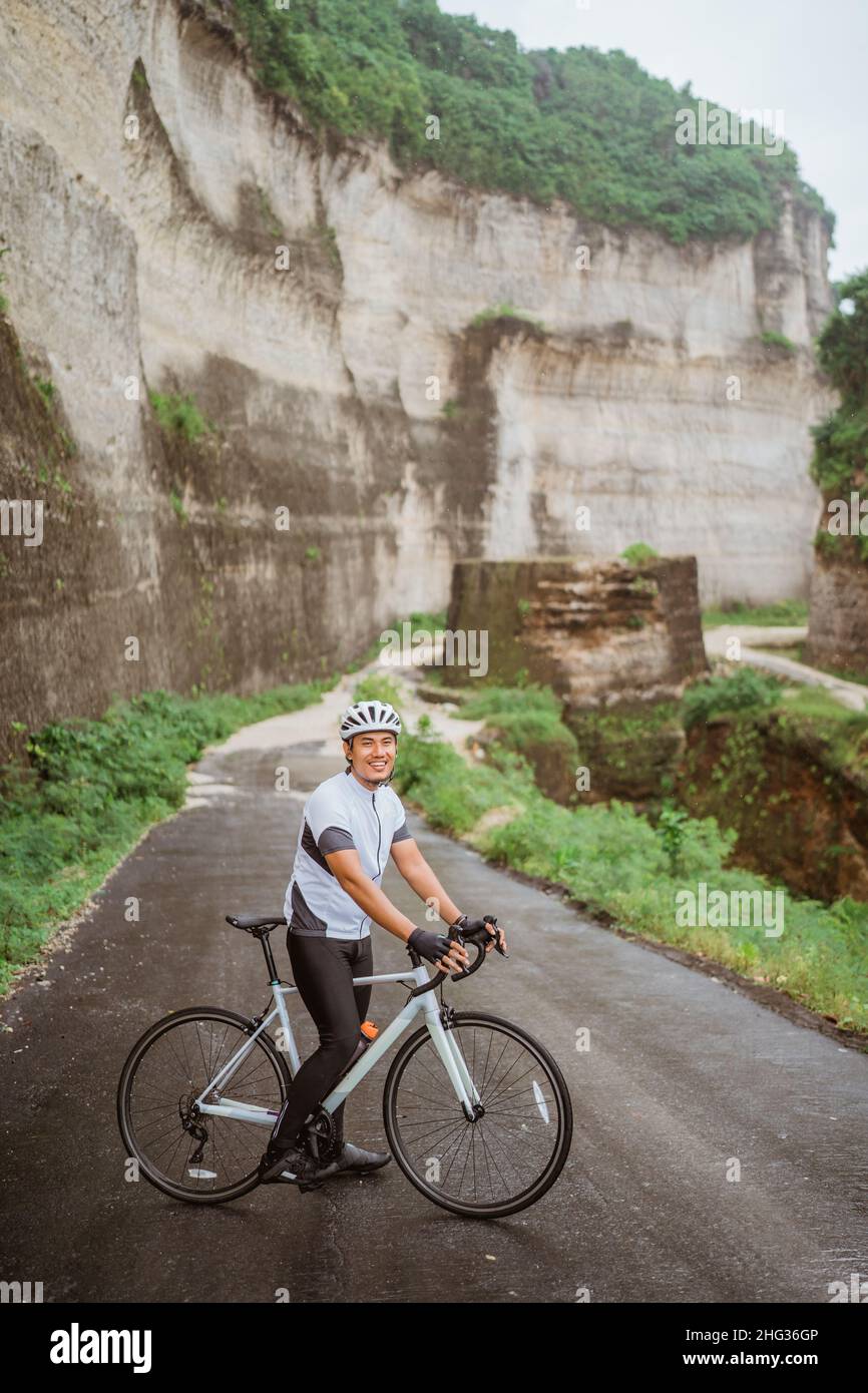 happy smiling road bike cyclist while riding his bike outdoor Stock ...