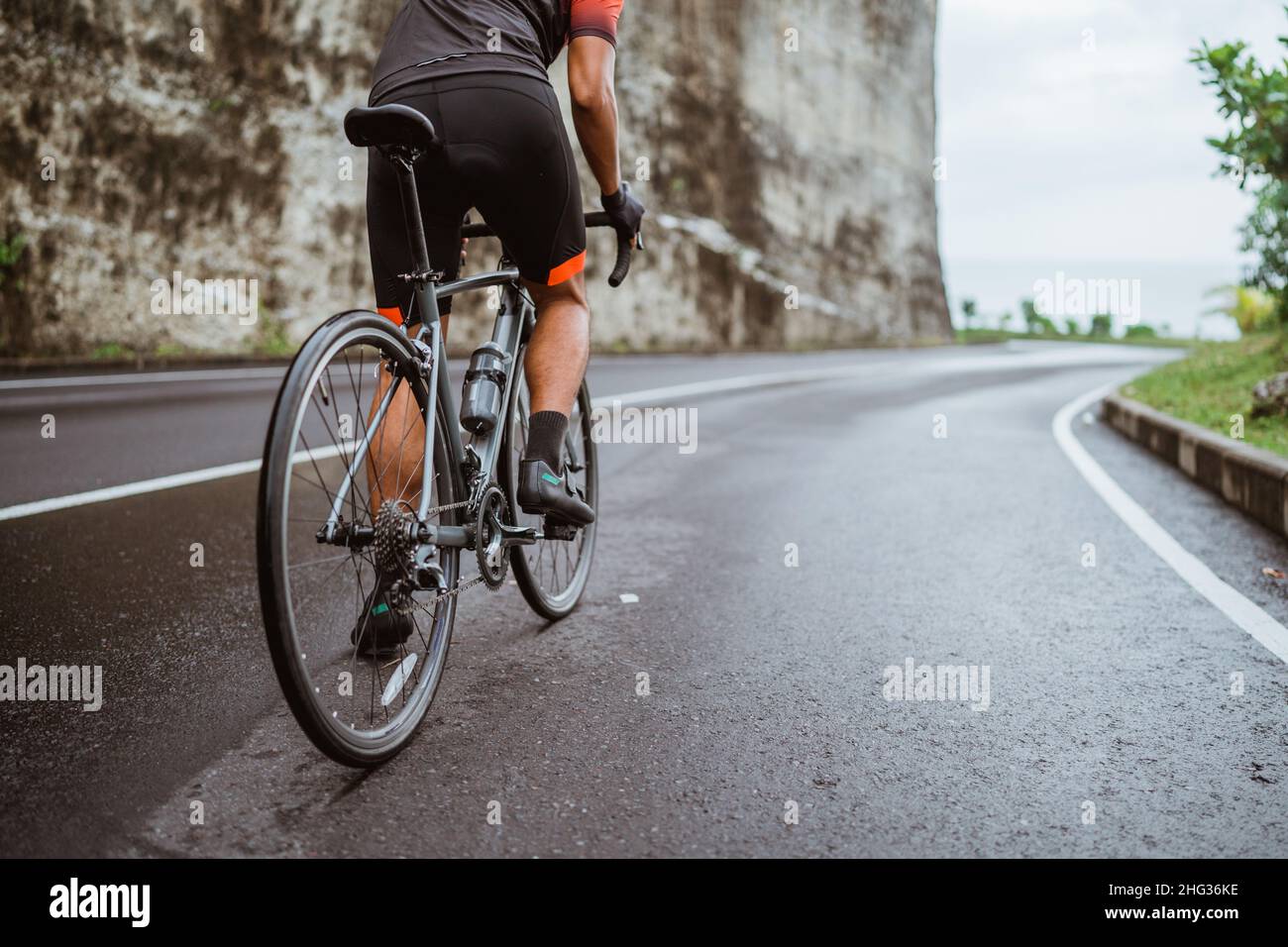 male cyclist riding his bike in country side shoot from the back Stock ...